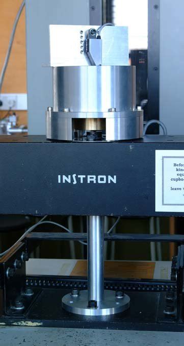 Instron Test Assembly The Flexures Are Hidden At The Top And Above Download Scientific