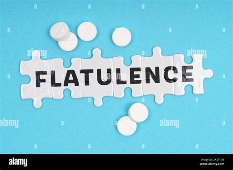 Medicine Concept On A Blue Background Pills And Puzzles With The