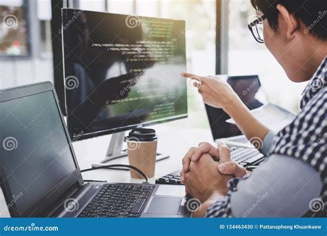 Programmers Cooperating At Developing Programming And Website Working In A Software Develop