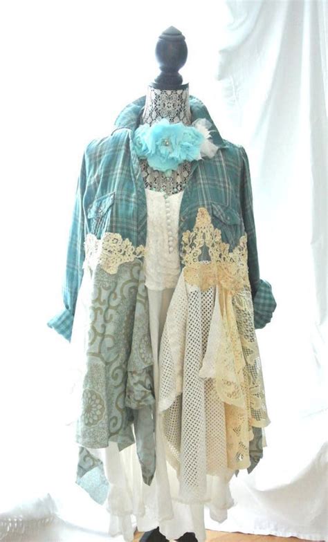 A Mannequin Is Dressed Up With Many Different Pieces Of Fabric And Laces