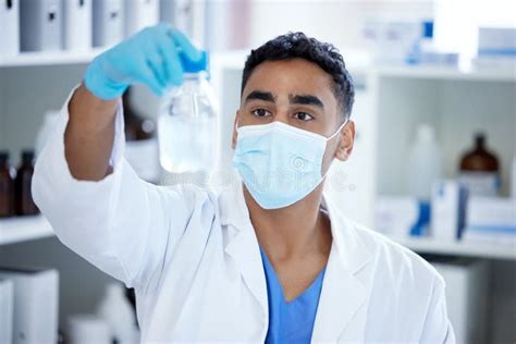 This Is Now Ready For Trial A Young Man Analysing A Sample In A Lab