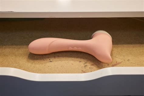 Premium Photo Different Sex Toys In Open Chest Of Drawers