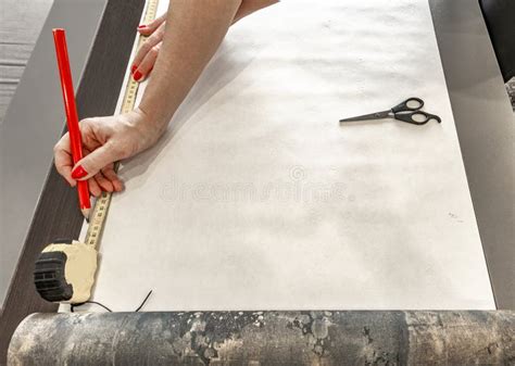 Cutting Wallpaper Before Sticking It To The Wall Scissors Measuring