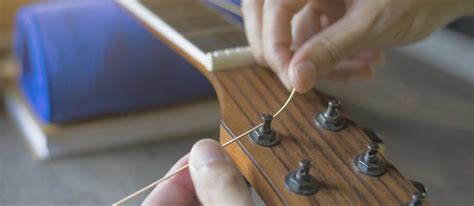 Guide To Restringing Your Acoustic Guitar Blue Hens Music 2025