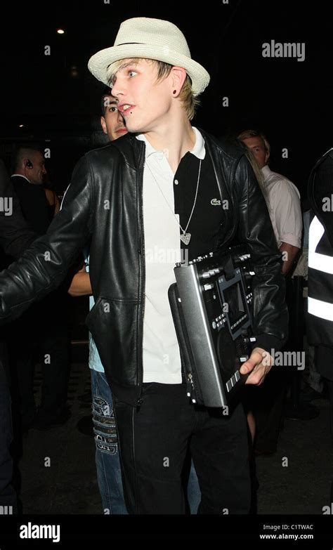 Luke Worrell Leaving Whisky Mist Nightclub Carrying A Mixing Deck Under His Arm London England