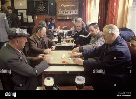 Working Class Men Their Local Pub Talk Share Pint Of Beer Over A Game