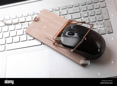Computer Mouse In Mousetrap On Laptop Keyboard Censored Internet And