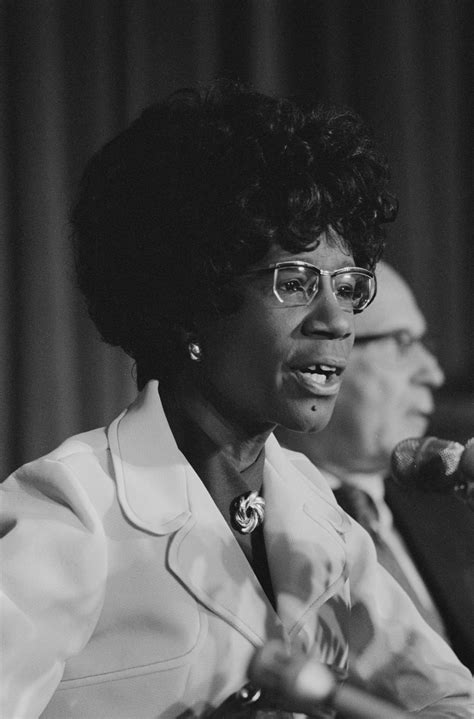 Congresswoman Shirley Chisholm Speaking Into A Microphone Photo Free