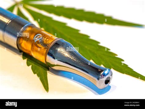 Cbd Vaporizer With A Cannabis Leaf Isolated On White Background Stock