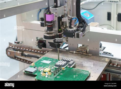 Automated Machine Assembling A Circuit Board Reflecting The Precision
