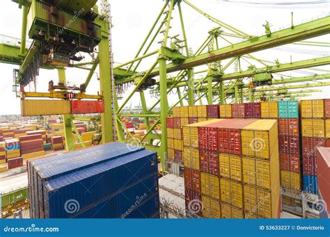 Container Operation In Port With Cranes And Gantry Loading Discharging Containers Royalty Free