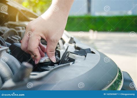 Checking The Coolant Level In The Car The Cap Of The Radiator Check Fluid Replacement Fluid