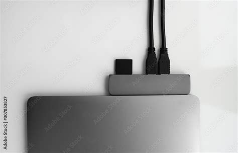 Laptop With Usb Type C Adapter With Pluged Usb Cables And Sd Card The Usb Adapter Under The