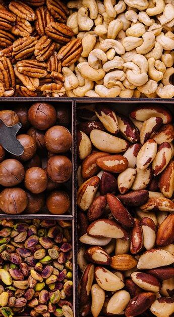 Premium Photo Assorted Nuts Close Up Top View Background