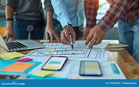 developer team brainstorming ui and ux designs for mobile app on paper