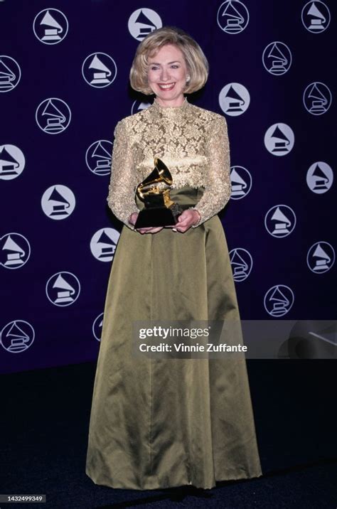 Us First Lady Hillary Clinton Holds The Grammy Award She Received In