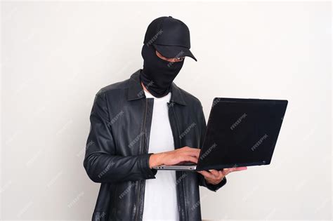 Premium Photo An Online Hacker Looking Doing Data Breaching On A Laptop