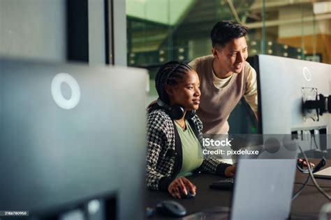 Software Engineers Collaborating On A Project Analyzing Code On