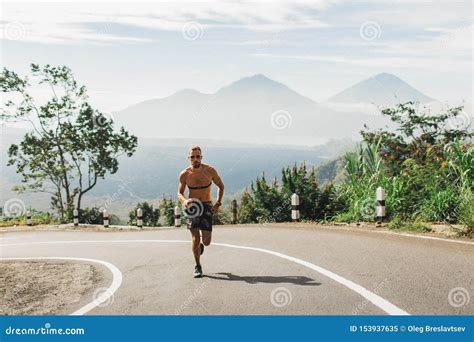 Man Running Topless In Uphill On The Asphalt Road Stock Image Image Of Body Marathon