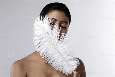 Young And Sensual Indian Woman With A Soft Ostrich Feather 16235656