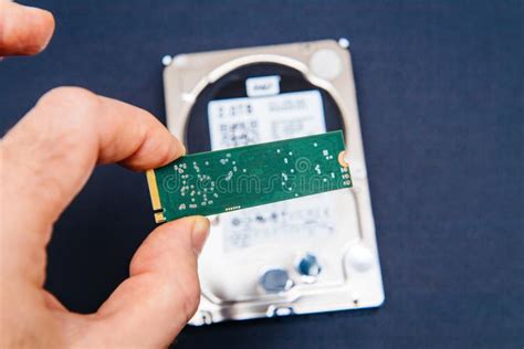 Man Holding NVME PCIE Fast Ssd Flash Memory Disk Drive With Old Stock Photo Image Of Focus