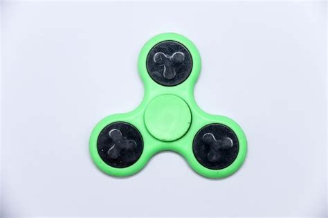 Premium Photo Close Up Of Fidget Spinner On White Background