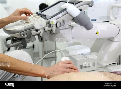 Ultrasonic Examination Of Internal Organs A Man On An Abdominal Ultrasound Scan Apparatus For