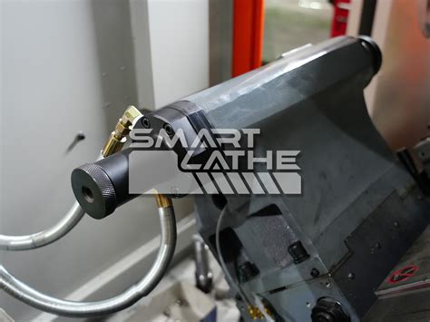 What function does the tailstock serve in the CNC machining process?