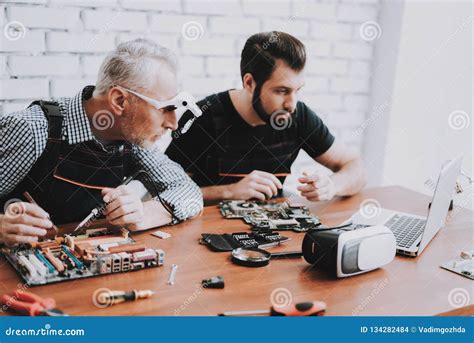 Two Men Repairing Hardware Equipment From PC Stock Photo Image Of Iron Electronic 134282484