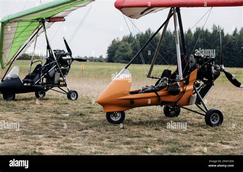 Motorized Hang Glider Over Green Grass Sports And Hobbies Private