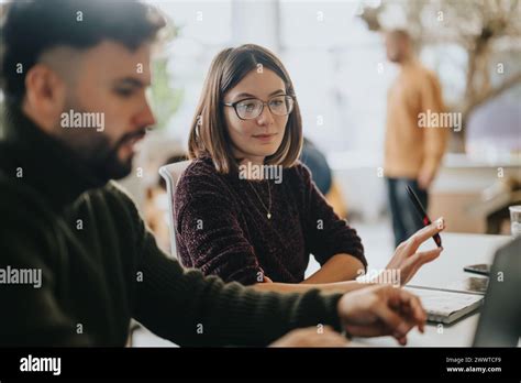 Successful Collaboration Of Multinational Business Team Analyzing Statistics And Brainstorming