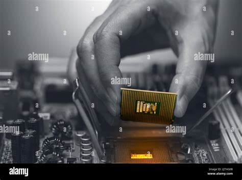 Electronic Engineer Hand Putting Computer Chip On Socket Chipset On
