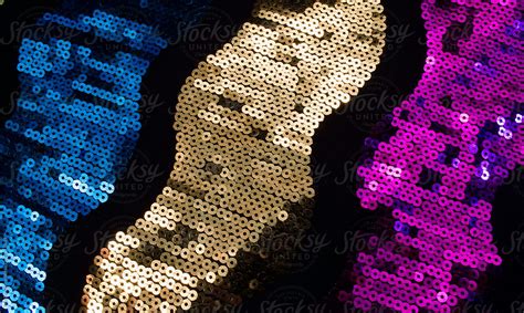 Closeup Macro Of Colored Sequins Forming A Pattern Of Colored Bands