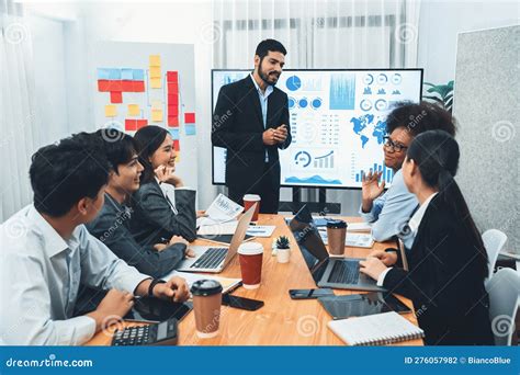 Businessman Presenting Data Analysis Dashboard On Tv At Meeting Room