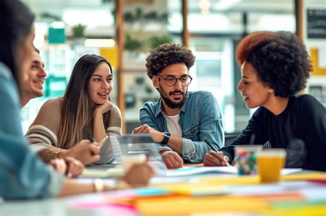 Premium Photo Team Members Collaborating On A Shared Project Or Brainstorming Session