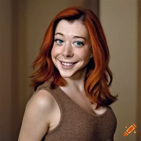 Alyson Hannigan Sitting In A Hotel Room Wearing A Dark Brown Sleeveless