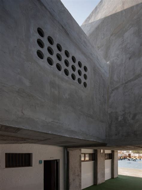 Circular Perforations Create Spotlights In Granada School
