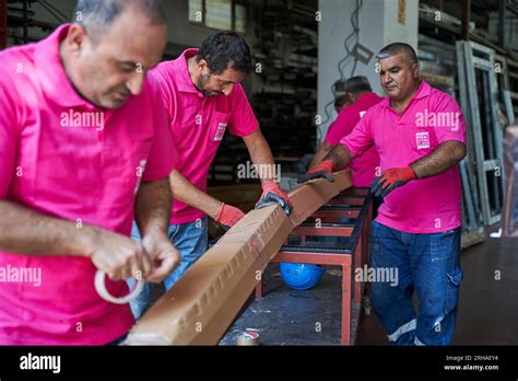 Workers Packing Cardboard Box In Warehouse For Shipment An Operator
