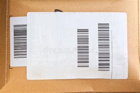 Brown And Beige Cardboard Paper Mail Envelope On Sticky Barcodes Stock Image Image Of Isolated
