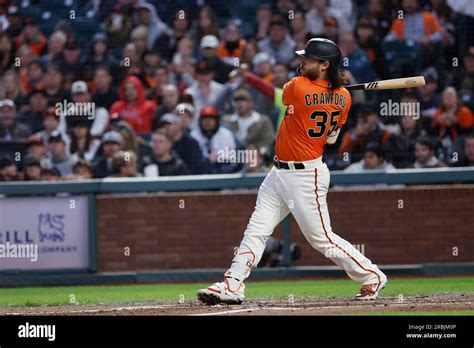 San Francisco Giants Brandon Crawford follows through on a two-run home run against Colorado ...