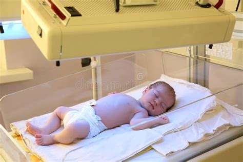 Newborn Child Under Ultraviolet Lamps Stock Image - Image of clinic ...