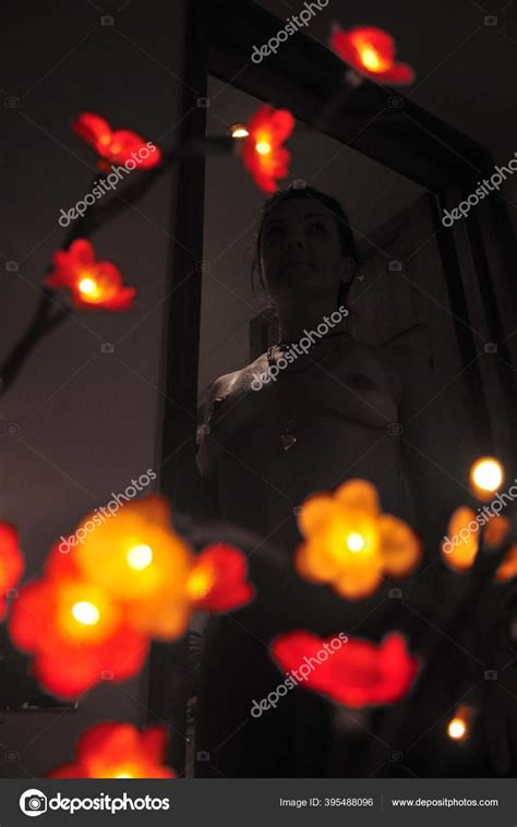 Nude Woman Body Low Key View Low Light Orange Flowers Stock Photo By Wirestock 395488096
