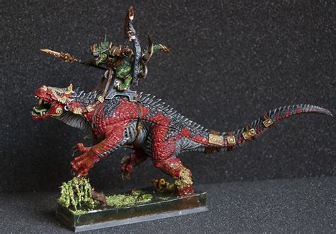 An Action Figure Is Posed On Top Of A Dinosaur