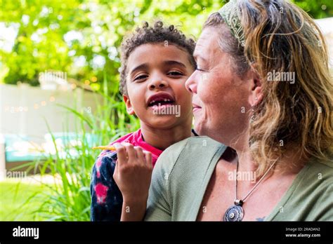 Mother Son In Backyard Stock Photo Alamy