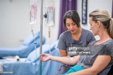 Female Patient With Intravenous Drip Photos And Premium High Res