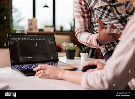 diverse web developers programming html script at home using