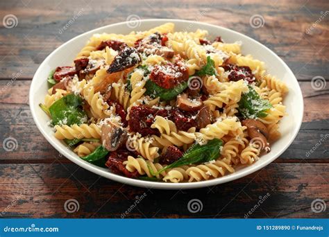 Fusilli Pasta With Sun Dried Tomatoes Mushrooms Parmesan Cheese And