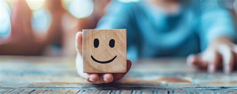 Premium Photo A Wooden Cube With A Smiley Face On It