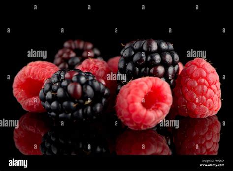 Composition From A Blackberry And Raspberry On The Black Isolated