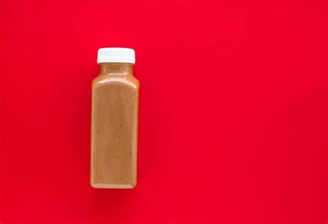 Premium Photo Chocolate Banana Smoothie Bottle On Red Flatlay